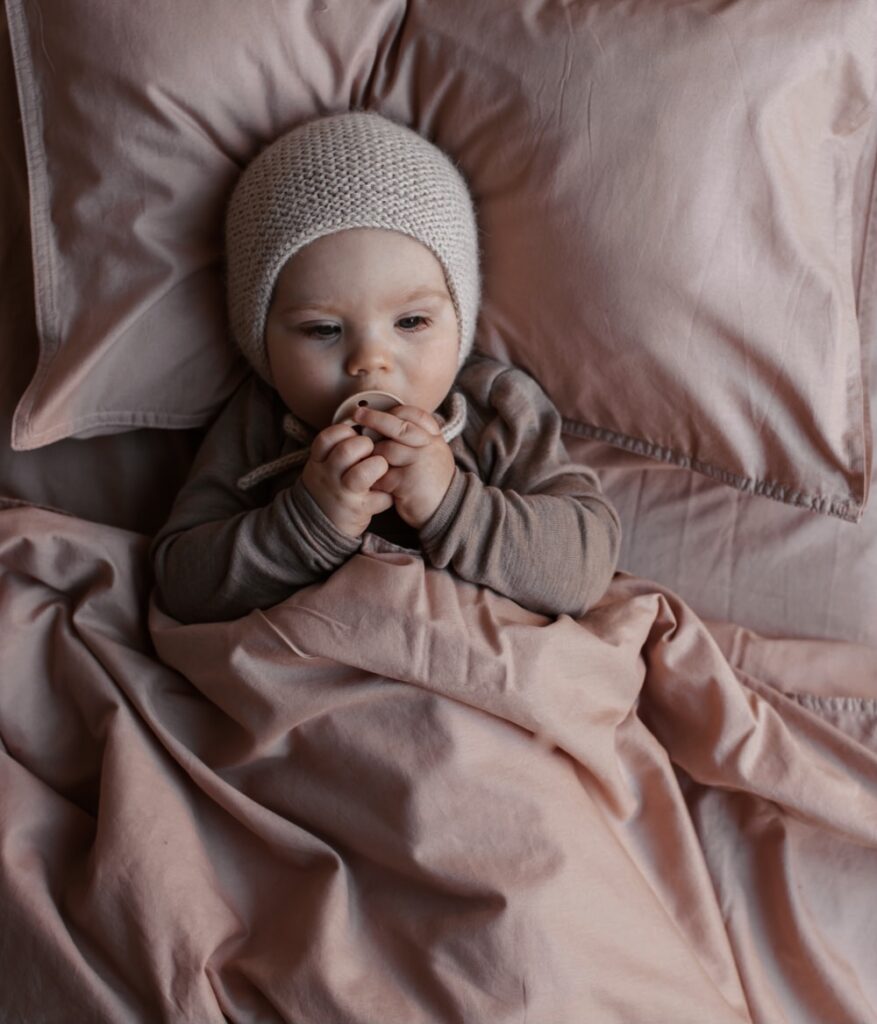Dusty pink baby bedding for cot and crib in organic cotton