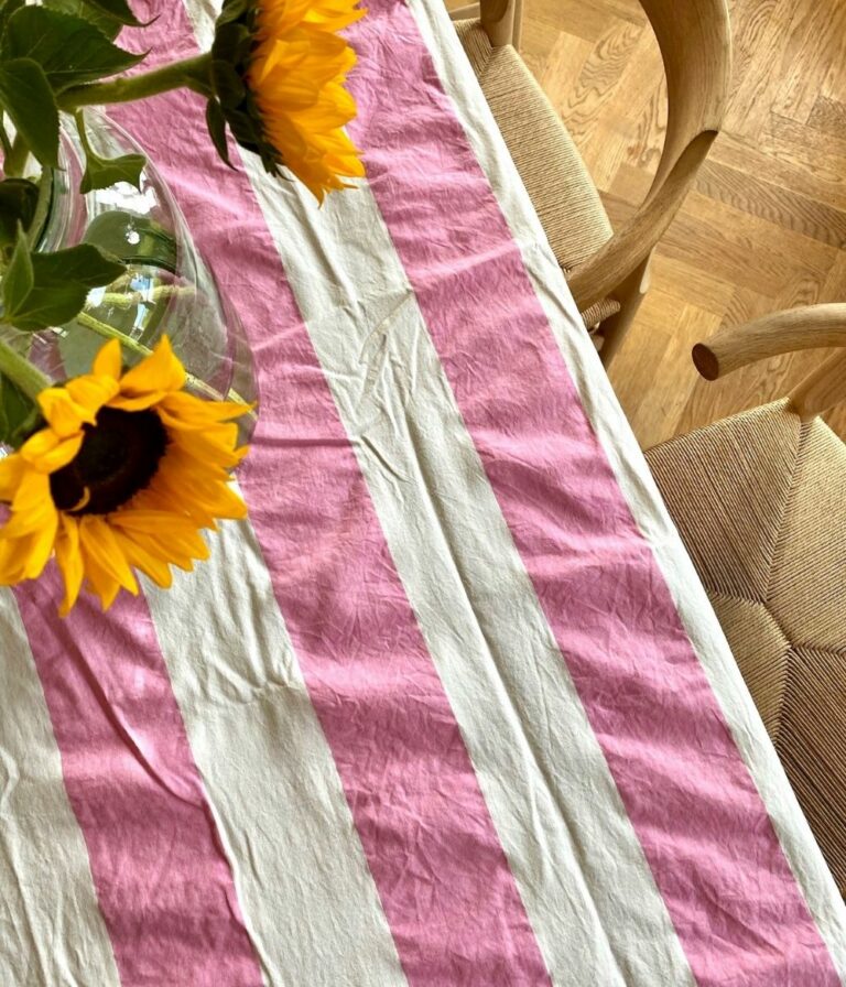 Pink and white striped tablecloth