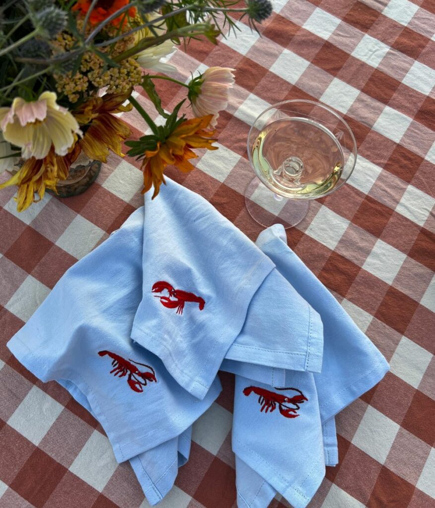 Light blue napkin with crayfish embroideries