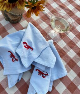 Light blue napkin with crayfish embroideries